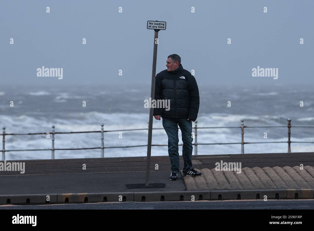 A man struggles to walk in high winds as Storm Éowyn batters Blackpool ...