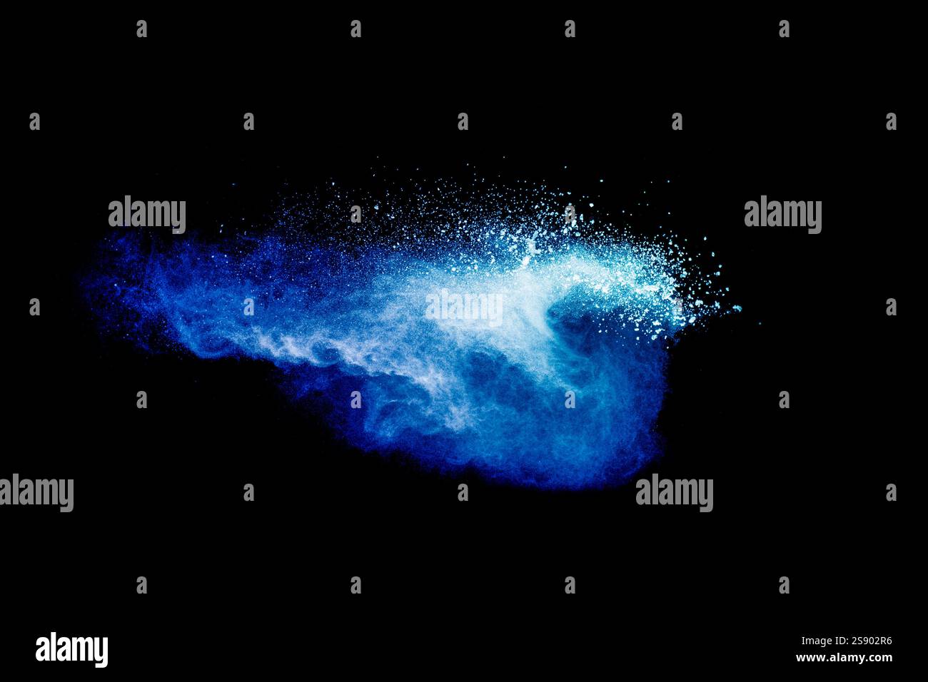 Abstract blue powder explosion on black background. Blue dust on dark ...