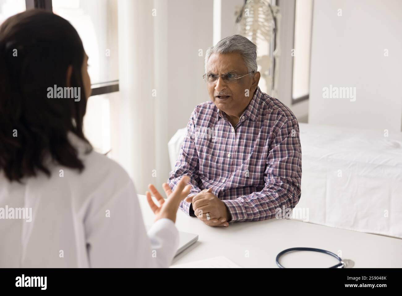 Professional doctor hold conversation with scared nervous shocked ...