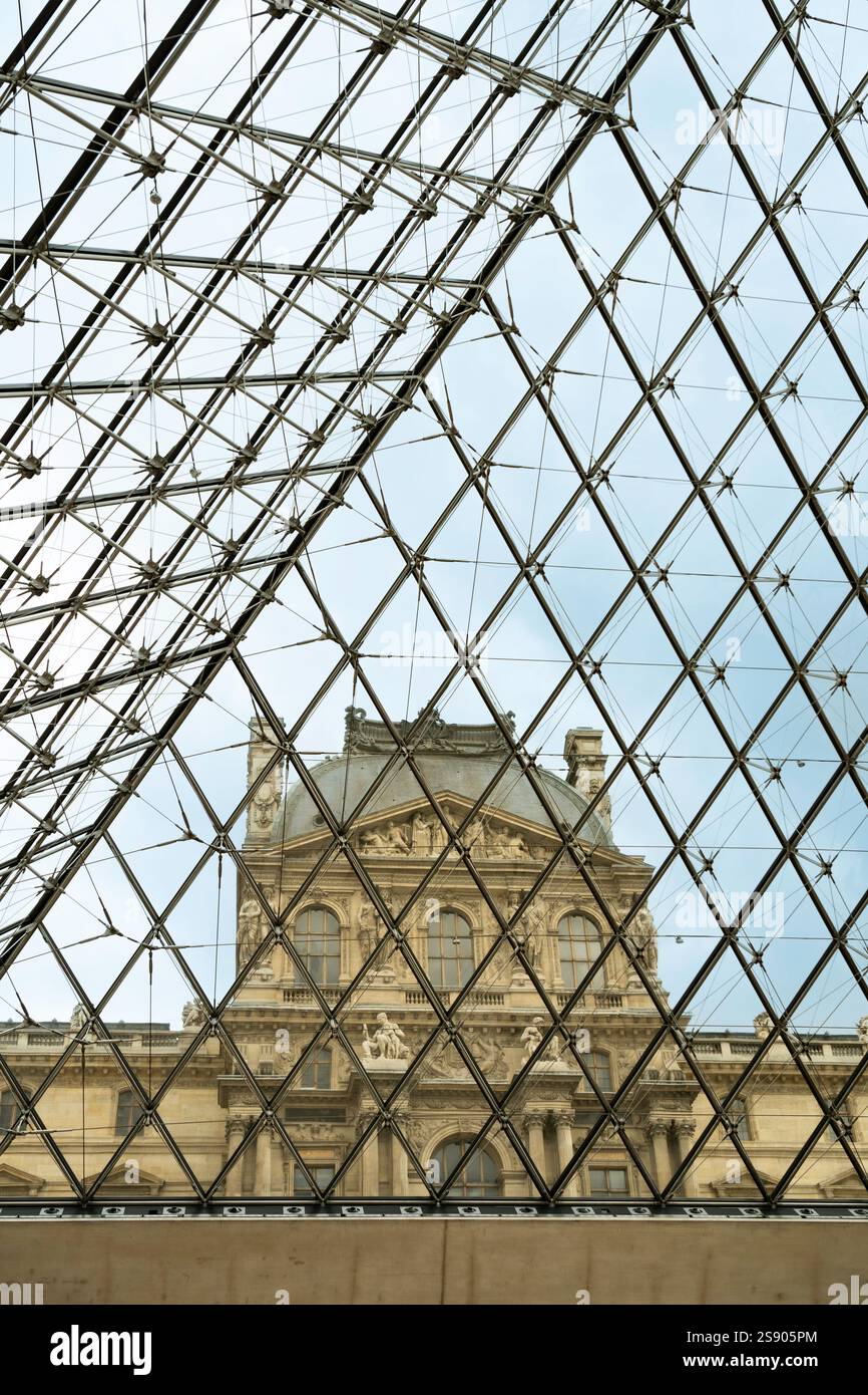 Paris, France View of Louvre Palace through the glass pyramid at Musee ...