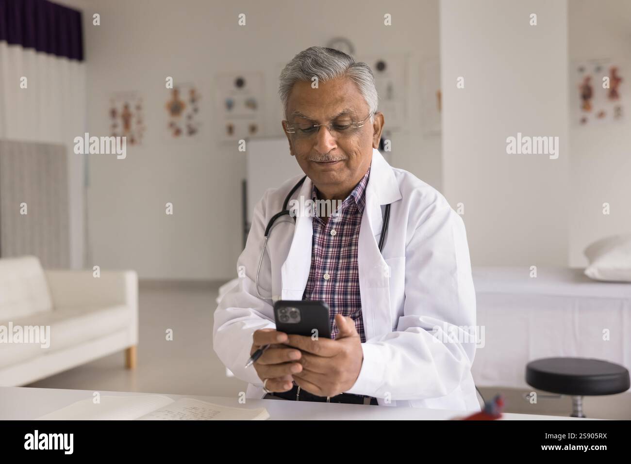 Focused aged doctor use modern cellphone read message text Stock Photo ...