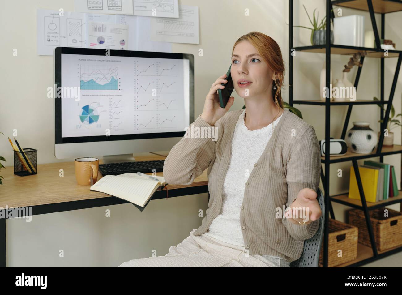 Woman on Phone Call While Sitting in Office Chair Stock Photo - Alamy