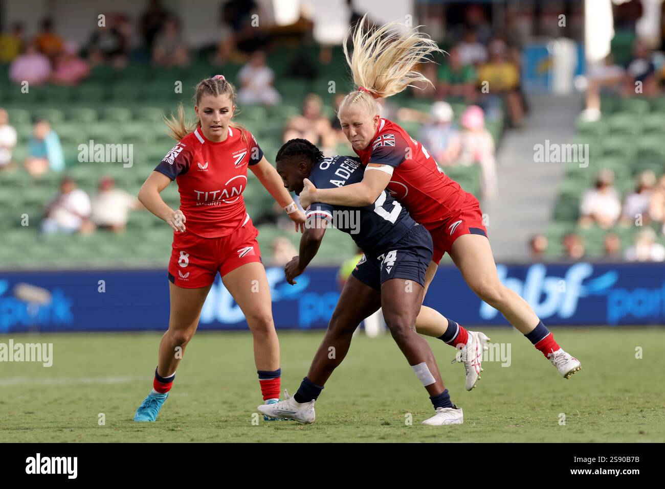 Susan Adegoke of the USA is tackled by Heather Cowell of Great Britain ...