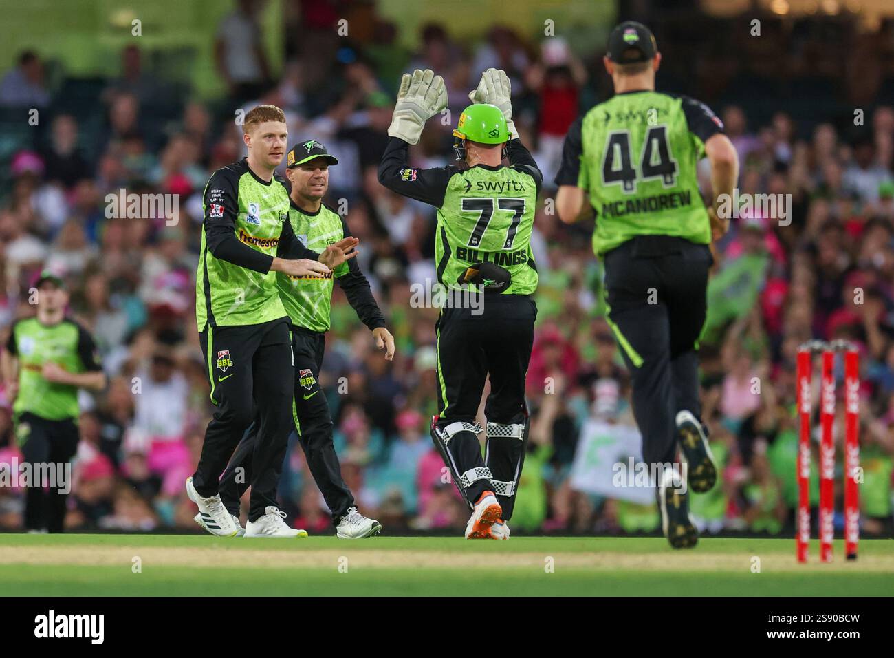 Tom Andrews of the Thunder (C) celebrates the wicket of Lachlan Shaw of ...