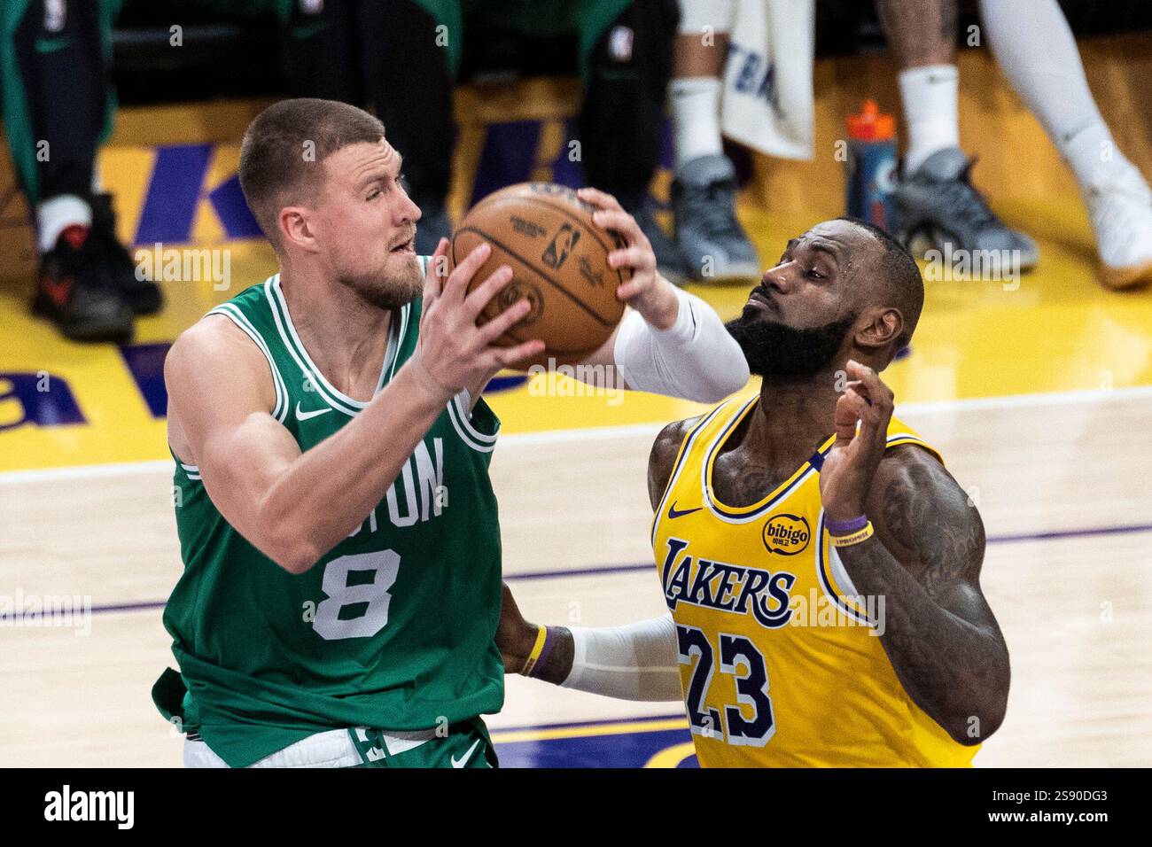 Boston Celtics' Kristaps Porzingis #8 is defended by Los Angeles Lakers' LeBron James #23 during ...