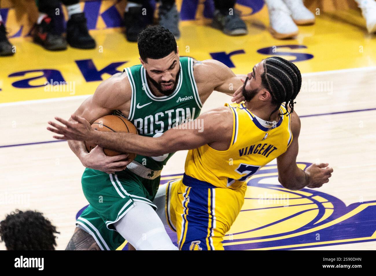 Boston Celtics' Jayson Tatum (L) drives against Los Angeles Lakers ...
