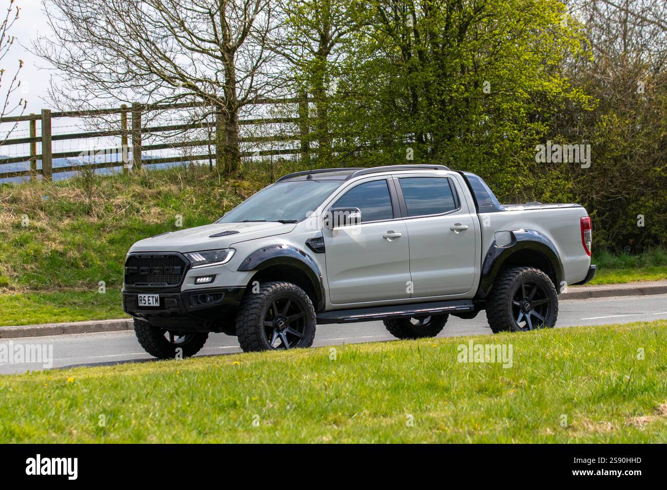 Ford Ranger Lightening all-electric robust pickup truck travelling in ...