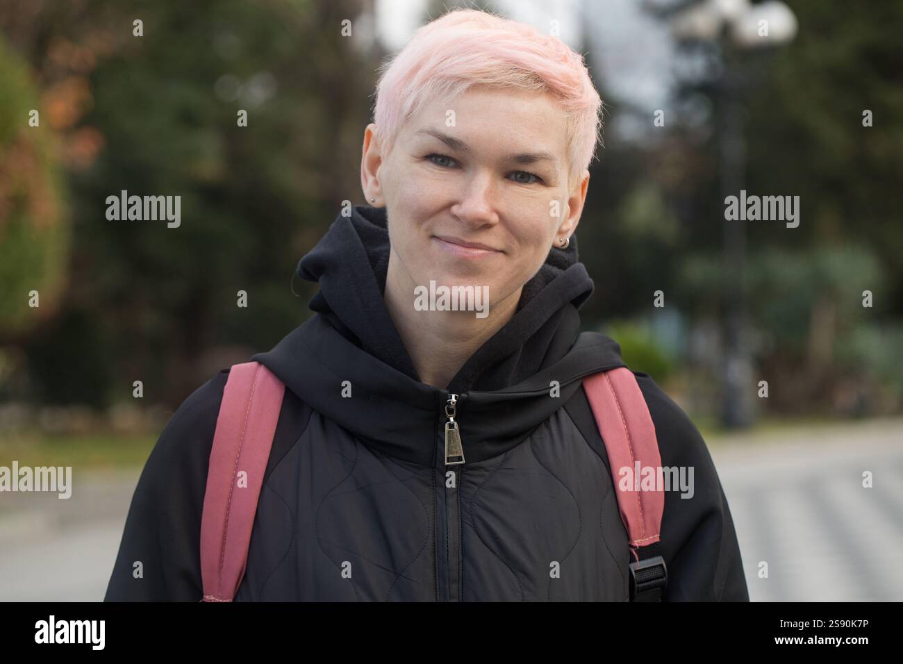 Happy mid adult woman in city park. Mature model traveler with elegant ...