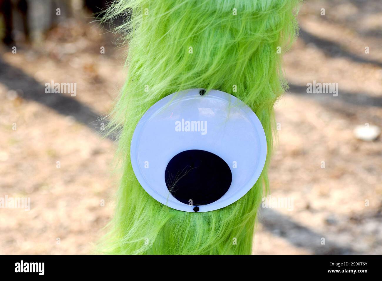 Trees in a park are put on brightly colored "sweaters" for winter in ...
