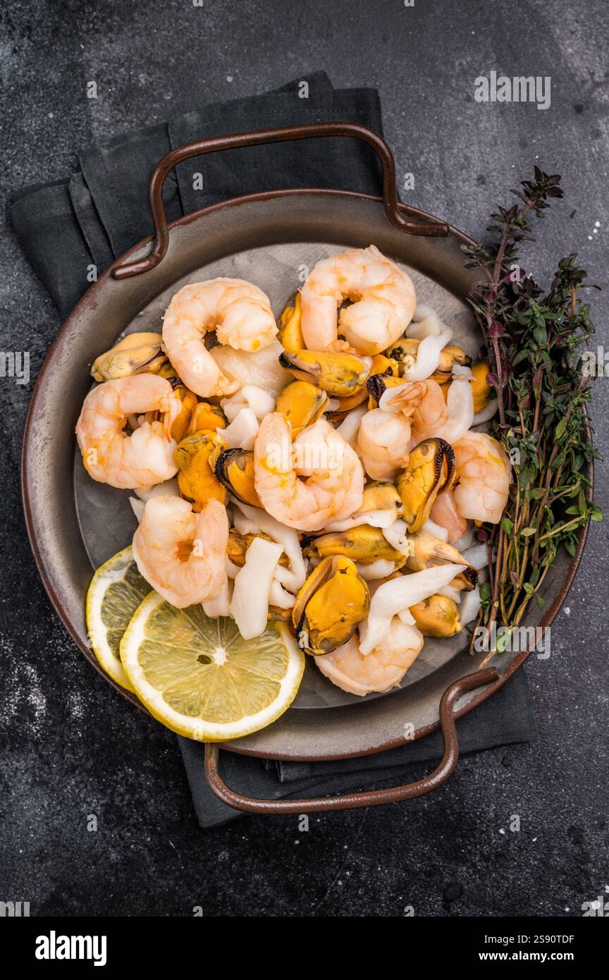 Fresh Seafood Mix with Mussels, Clams, Prawns, Shrimps and squid. black ...