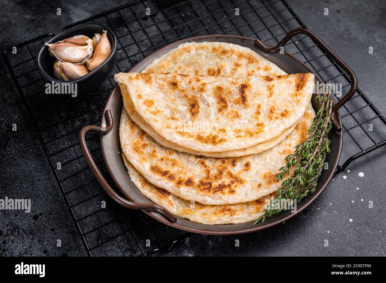 Aloo Paratha Indian Potato stuffed Flatbread. black background. top ...