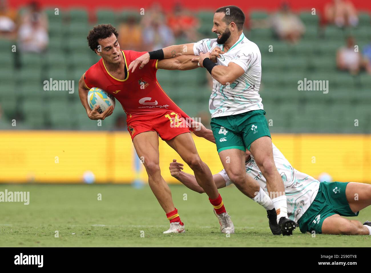 Eduardo Lopez of Spain is tackled by Mark Roche of Ireland during the ...