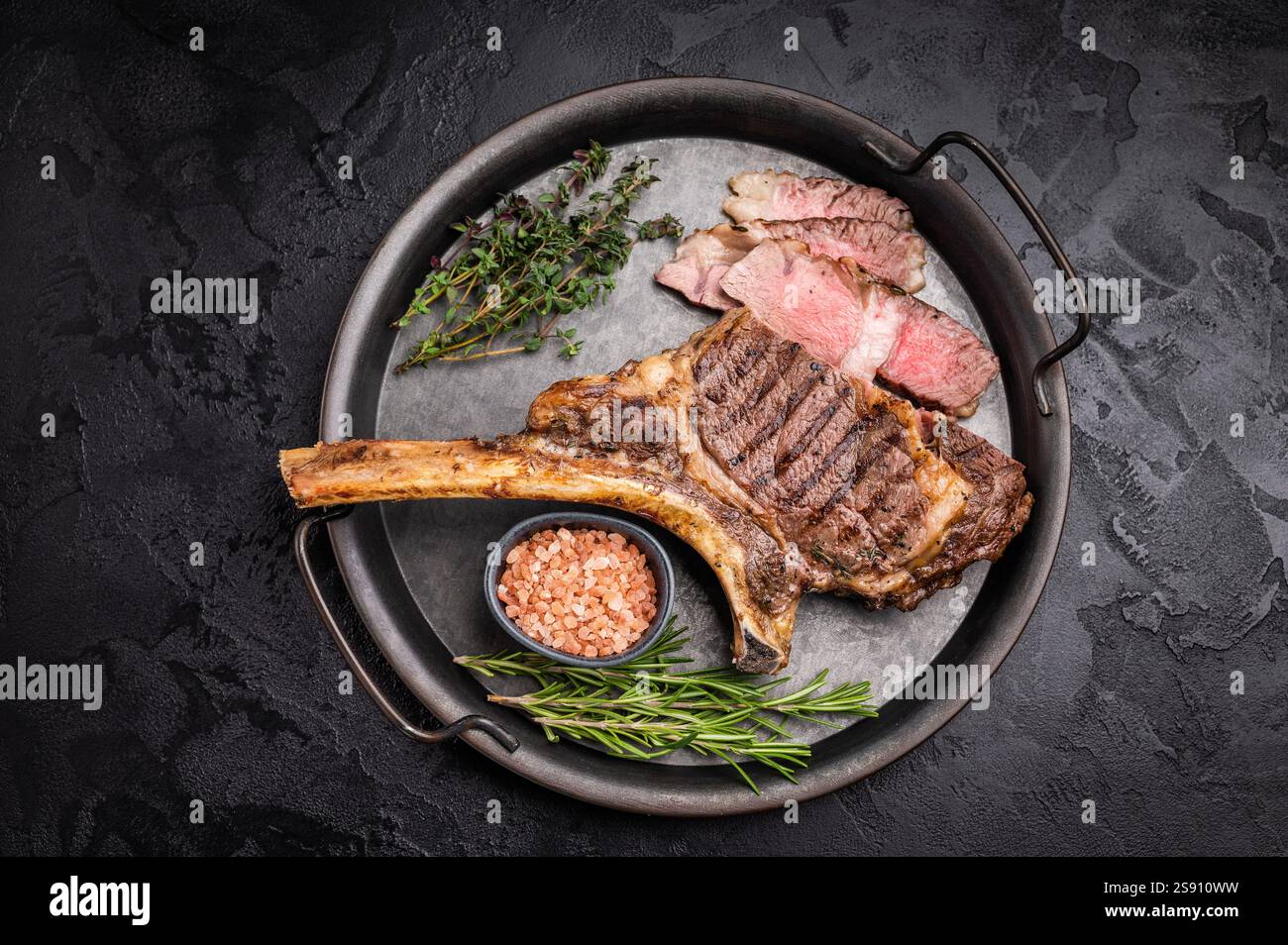 Roasted Tomahawk beef steak, roast dry aged rib eye with bone. black ...
