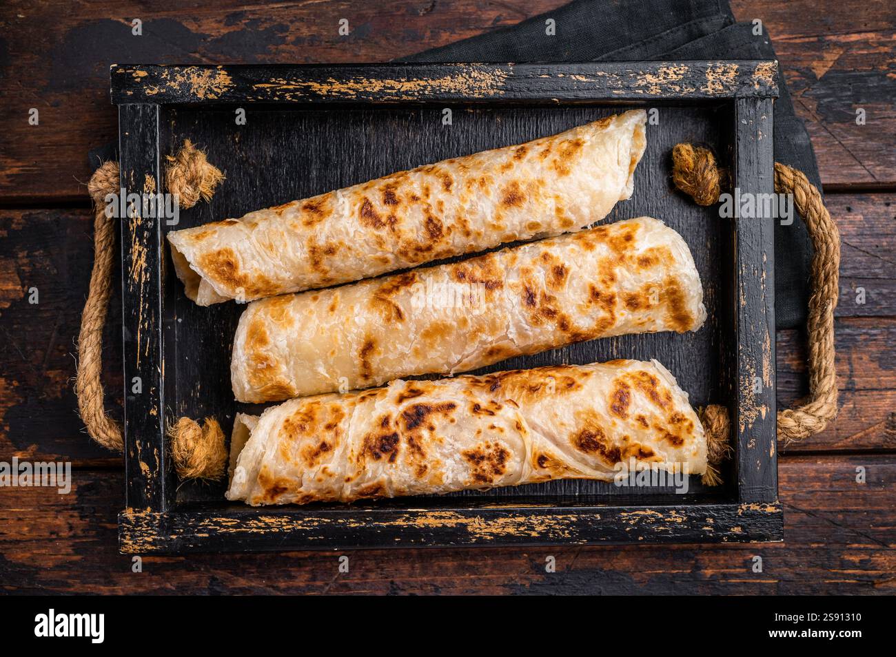 Aloo Paratha rolls, Indian Flatbread. wooden background. top view Stock ...