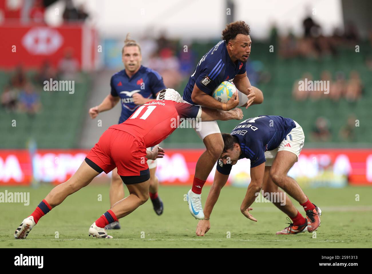 Liam Delamare of France is tackled by Ethan Waddleton of Great Britain ...