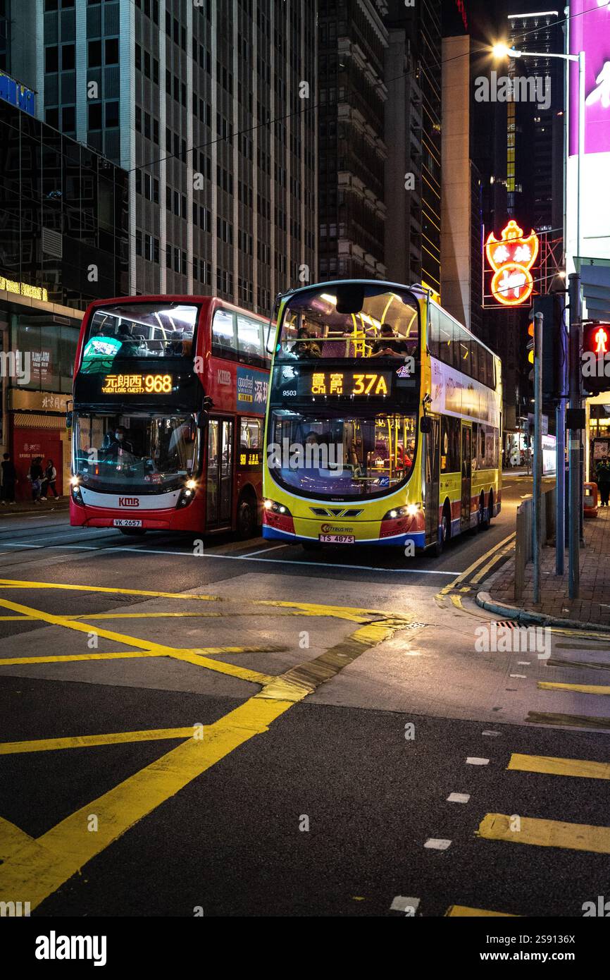 Night photography of 2 a red and yellow public buses in Hong Kong Stock ...