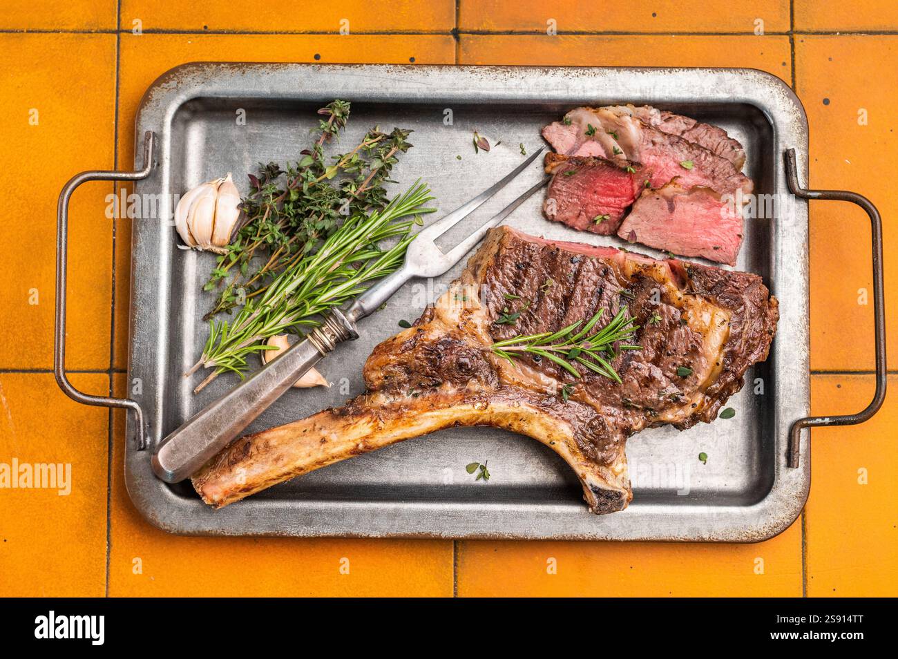BBQ cooked Tomahawk beef steak, prime ribeye with bone on tray with ...