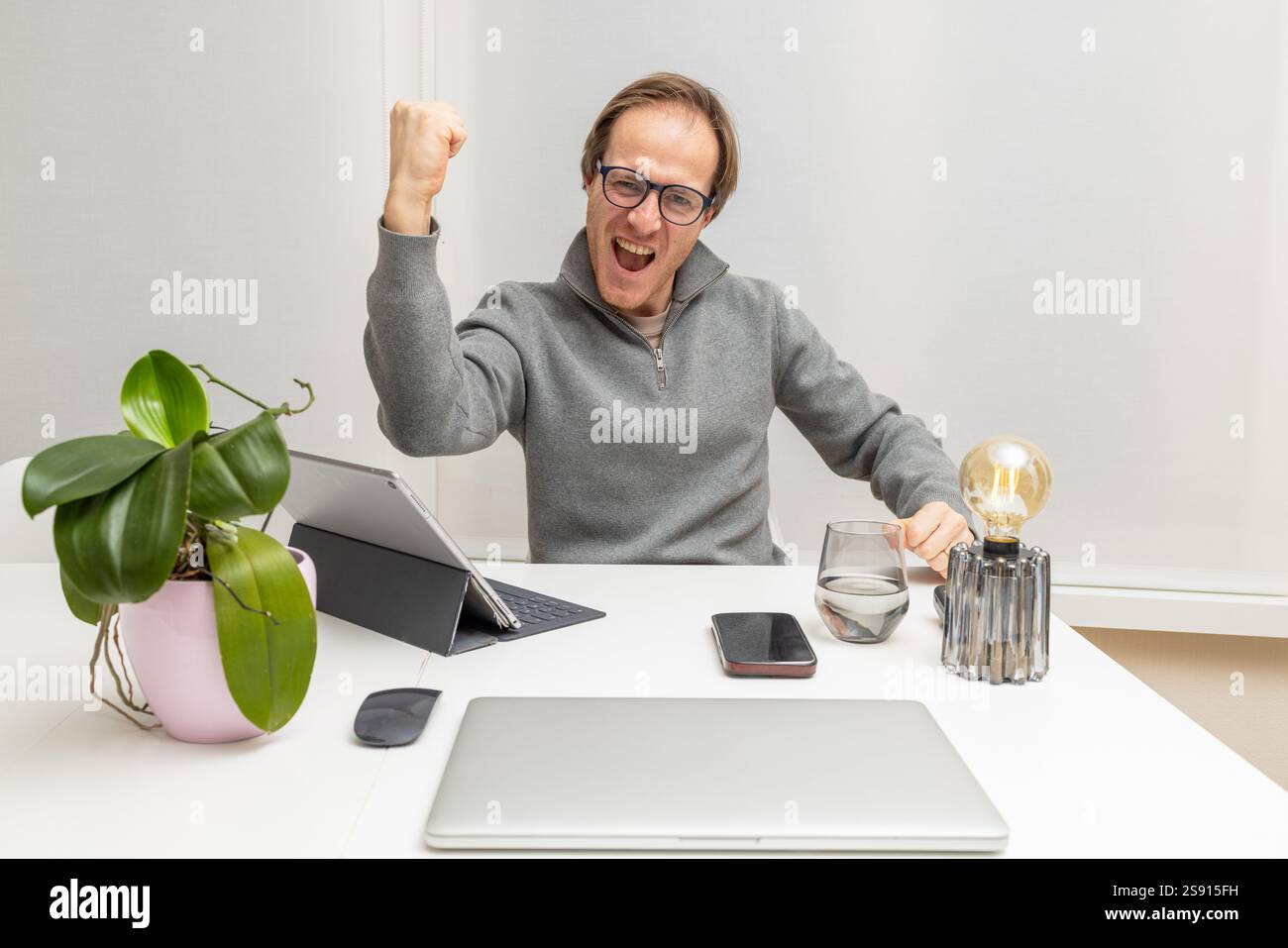 Celebrating Success: A Joyful Moment of Achievement Stock Photo - Alamy