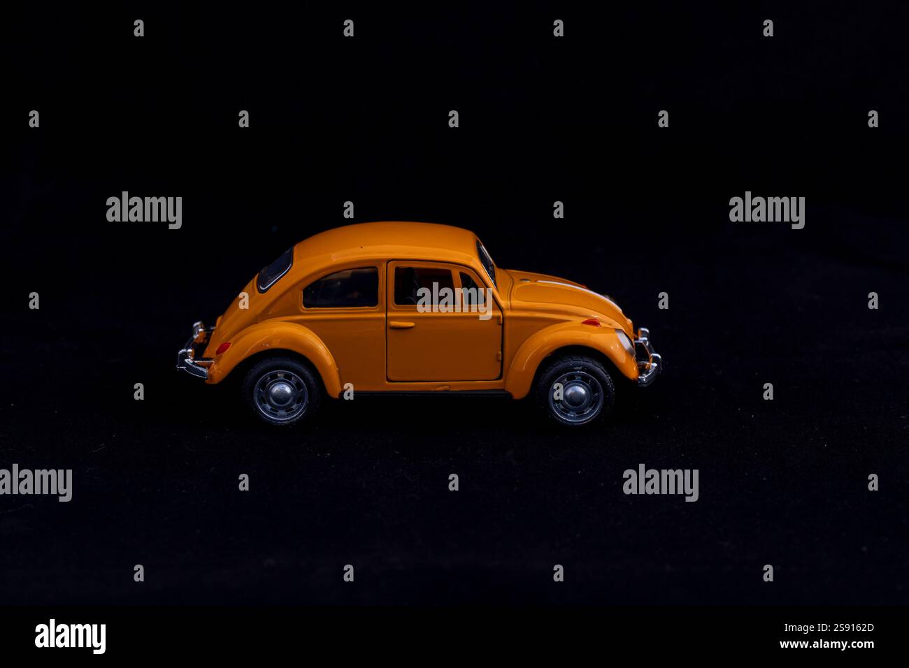 Classic Yellow Beetle Model Car Side View on Black Background Stock ...