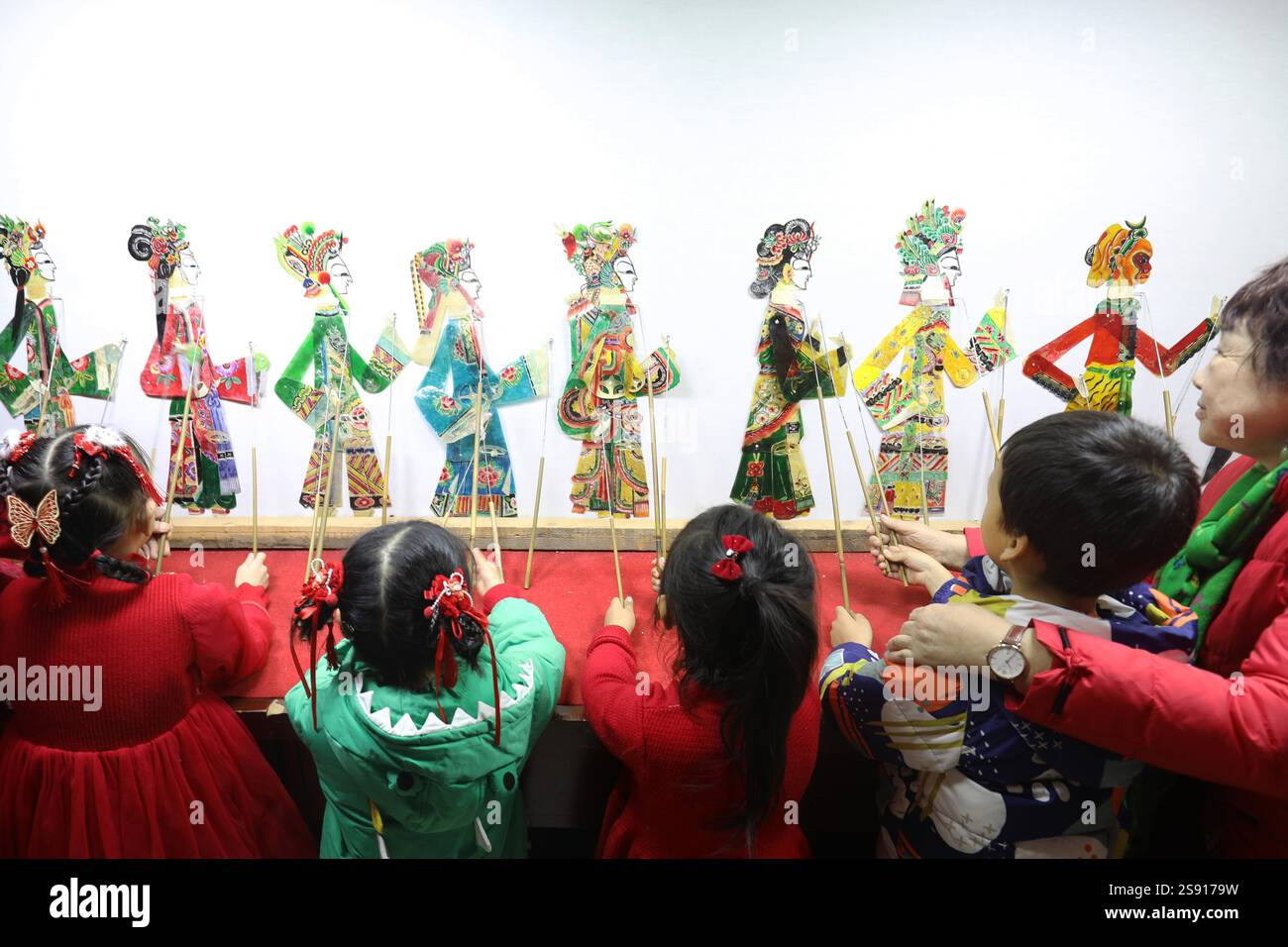 Children experience the shadow puppet play in Tangshan City, north ...