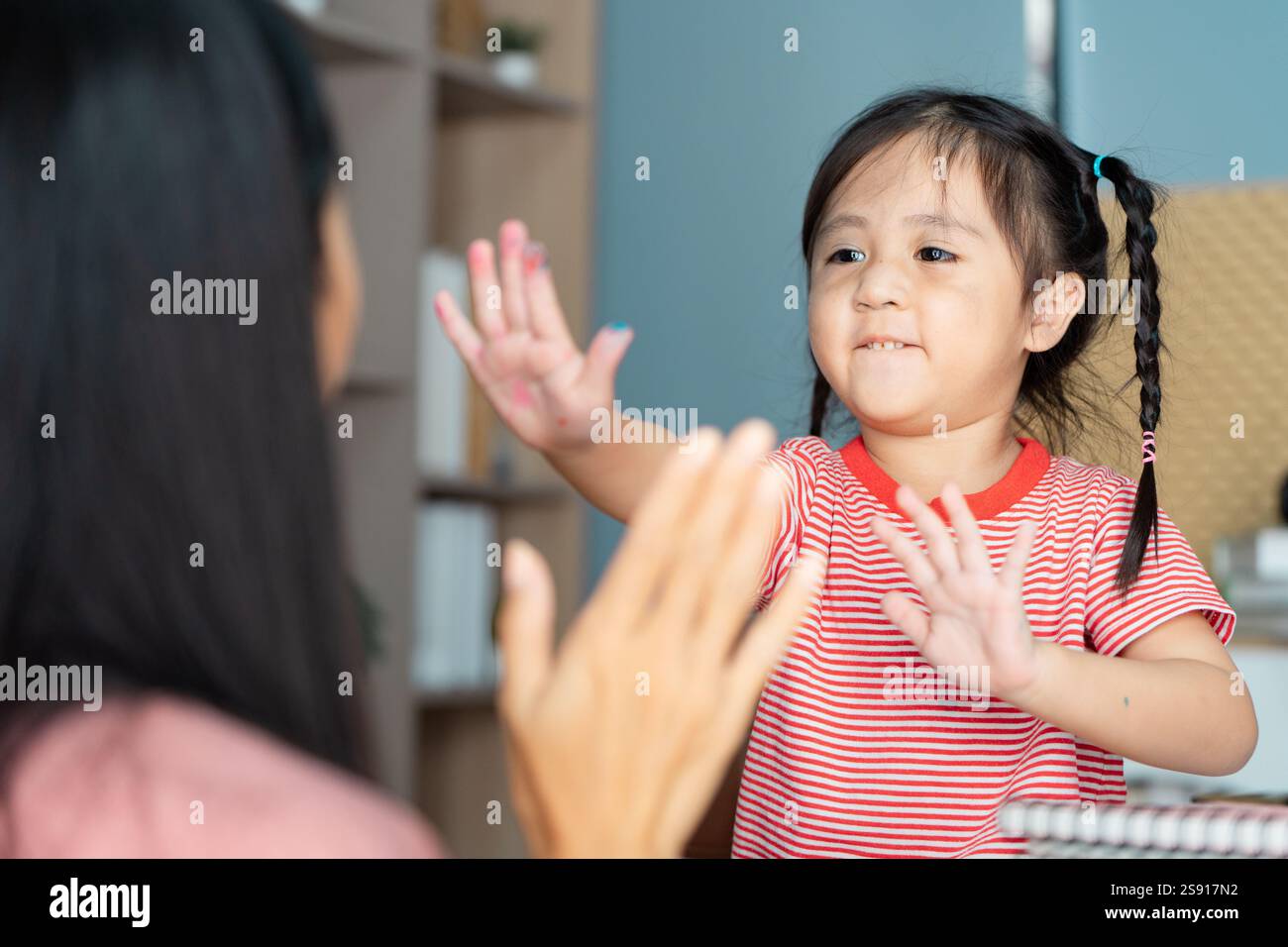 Joyful learning moments with a mother and child celebrating creativity ...