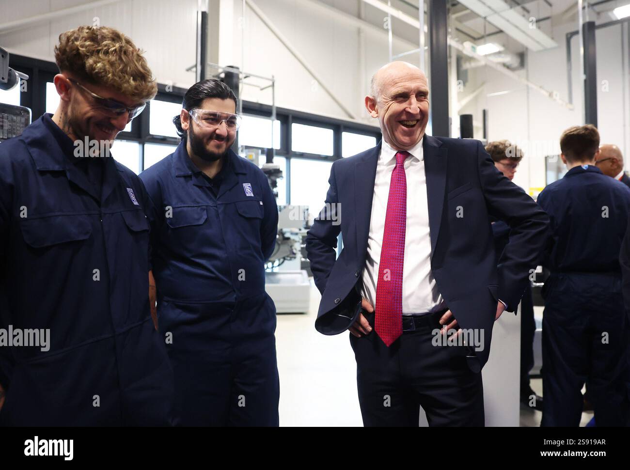 Defence Secretary John Healey (right) speaks to apprentices during his ...