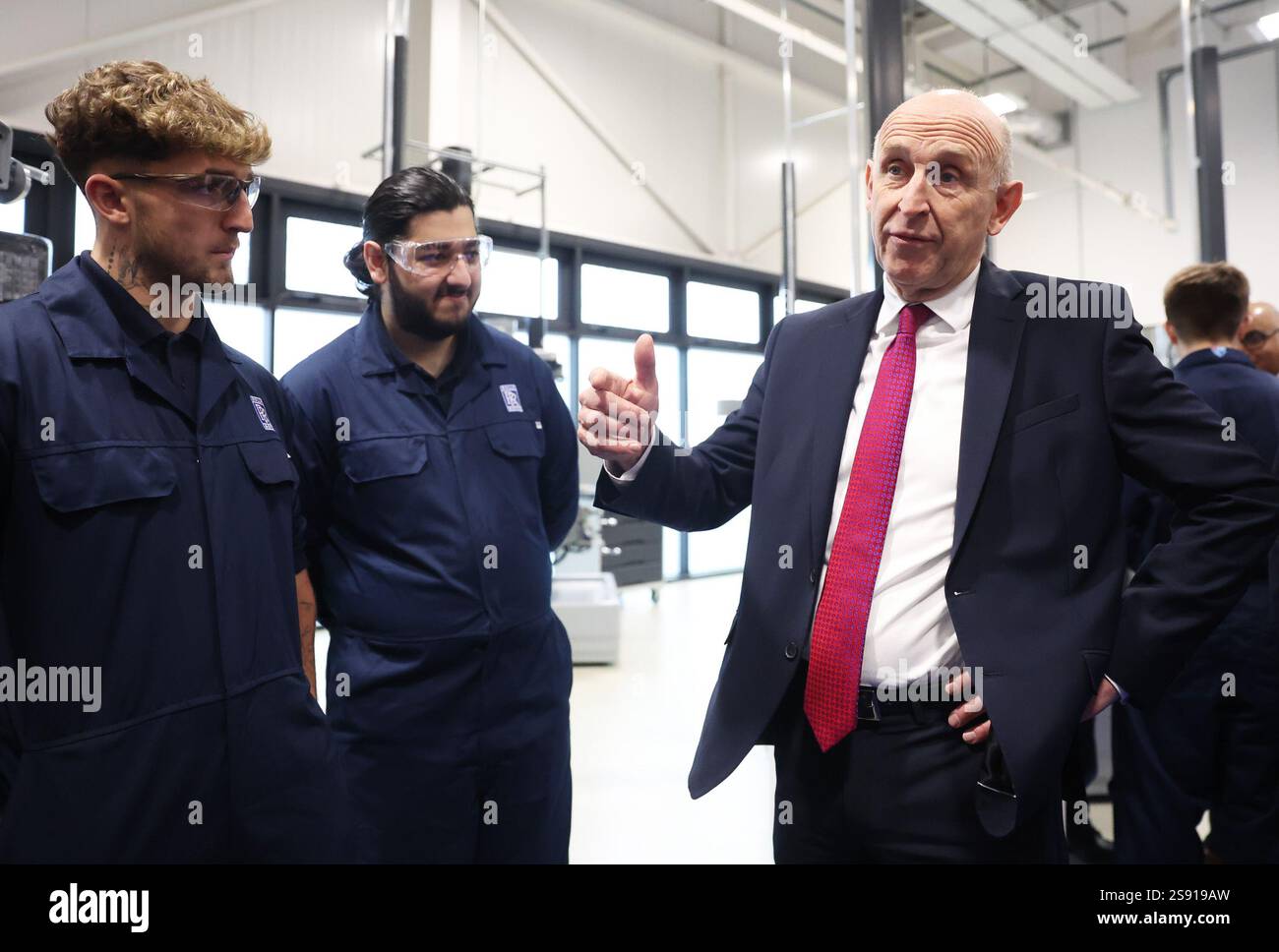 Defence Secretary John Healey (right) speaks to apprentices during his ...