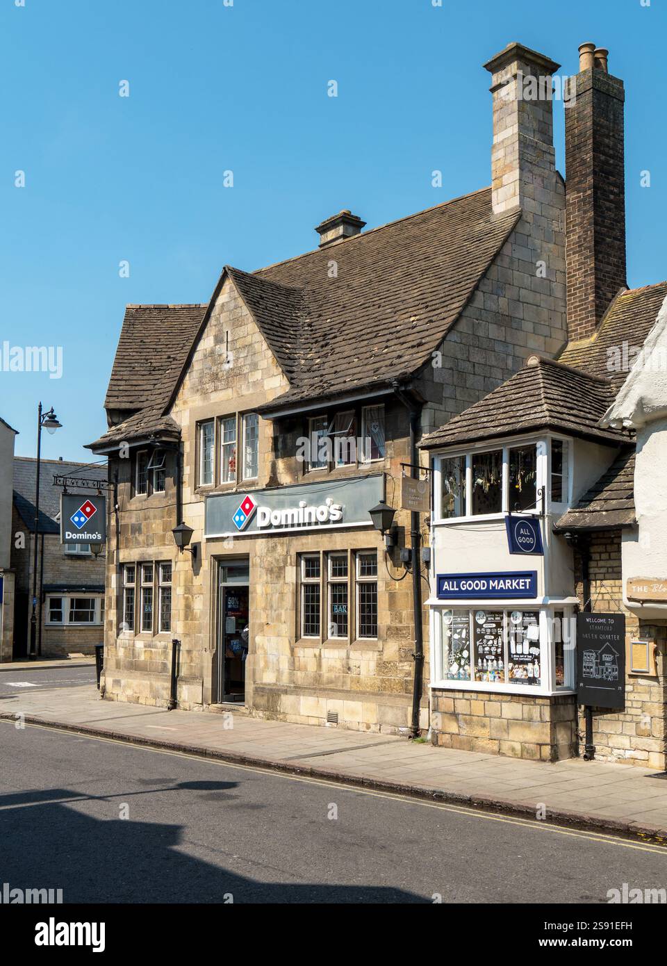 Domino's Pizza takeaway shop in old stone building on a sunny June day ...
