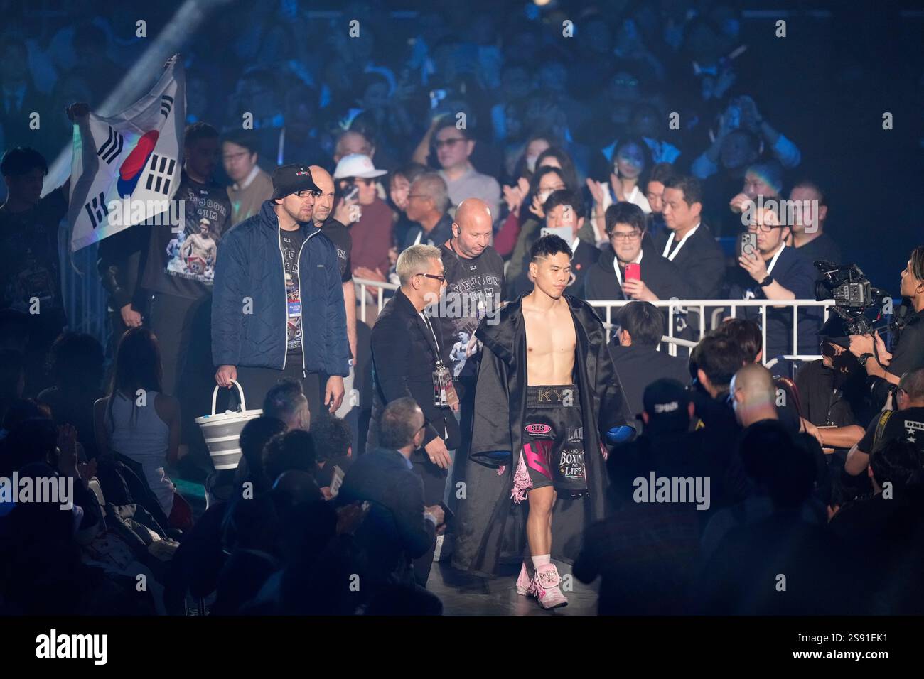 South Korea challenger Ye Joon Kim walks towards the ring to compete ...