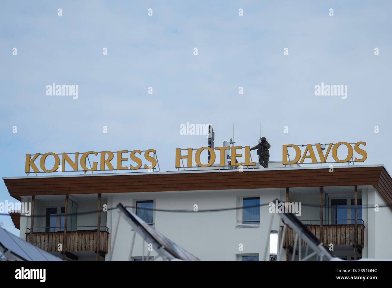 A police officer stands guards on the roof of the Congress Hotel on the ...