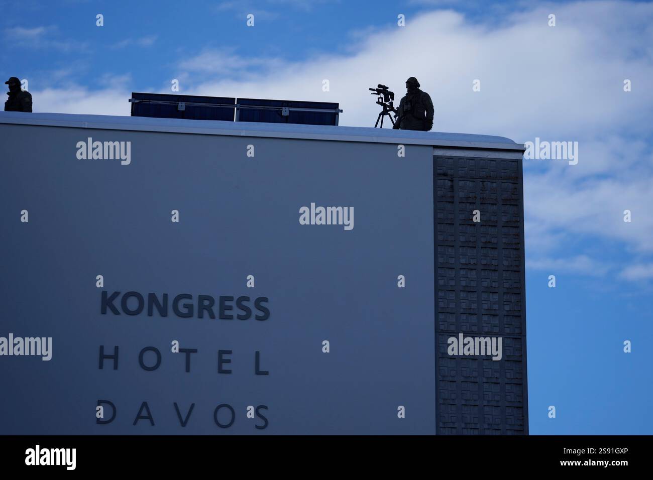 Police officers stand guard on the roof of the Congress Hotel on the ...
