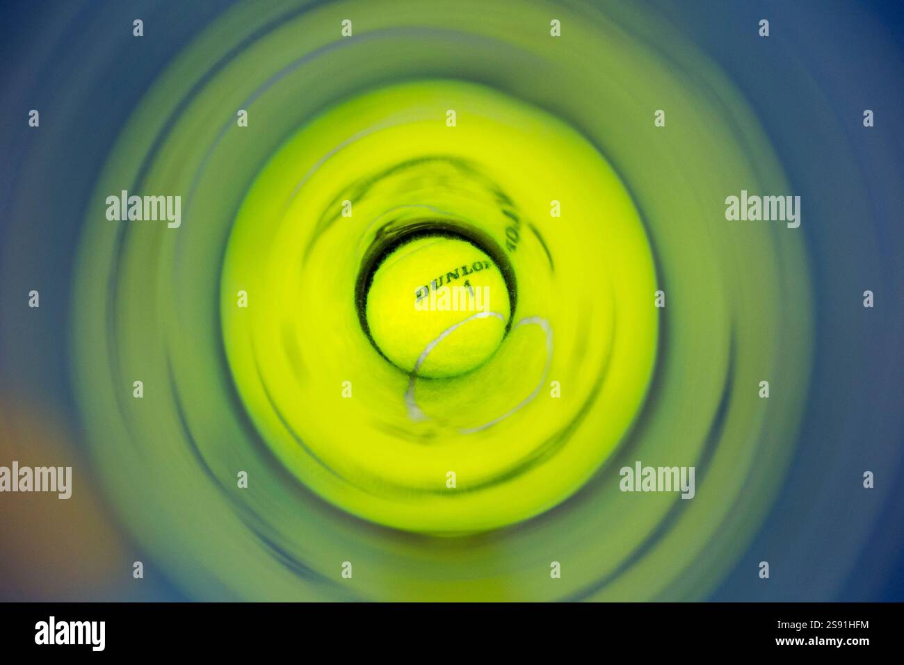 Tennis ball seen down the length of a tennis balls collector ...