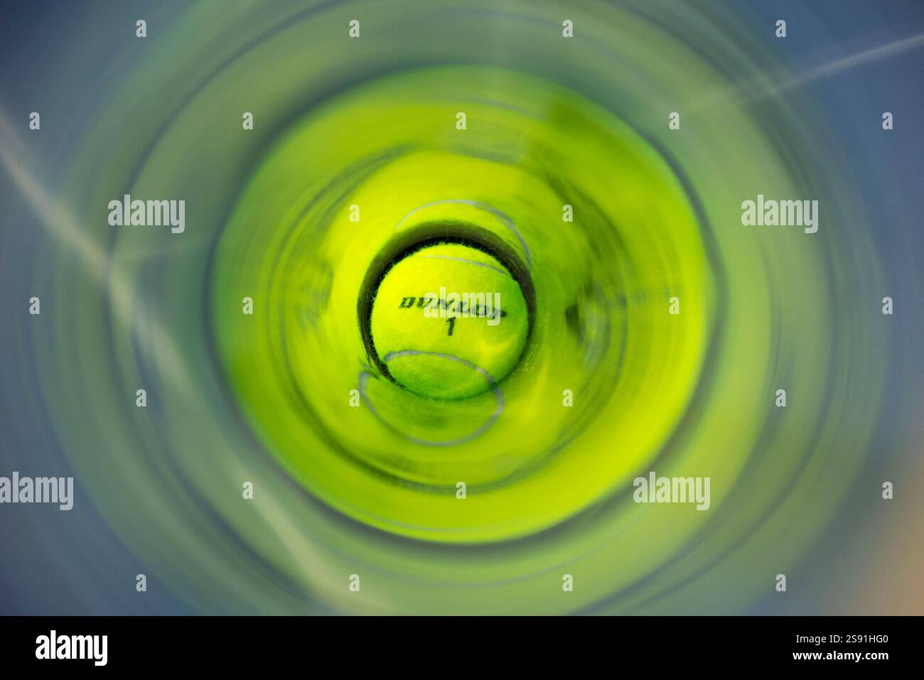 Tennis ball seen down the length of a tennis balls collector ...