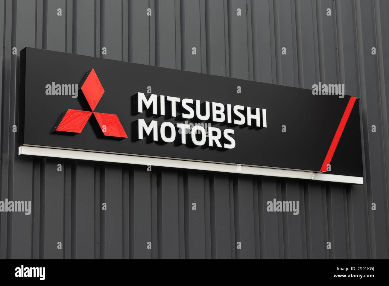 Mitsubishi motors logo at the car dealer store. Mitsubishi Motors ...