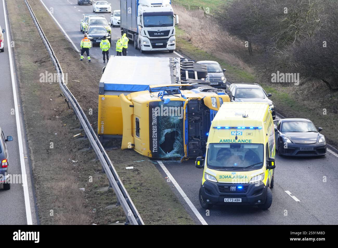 An ambulance attends the scene of a crash during strong winds on the north bound A19 near to the ...