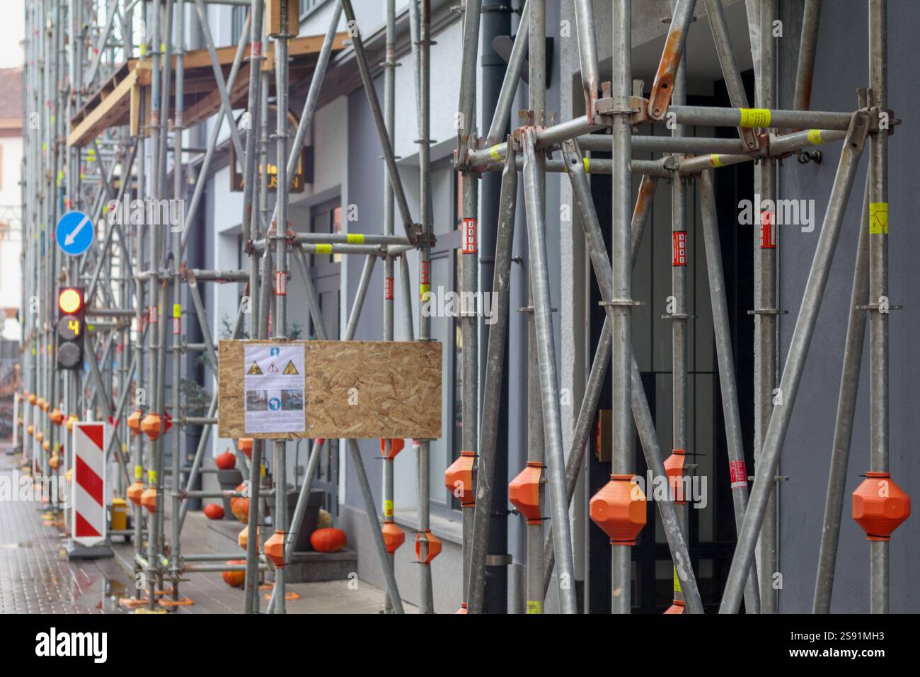 The facade of the building, which is completely covered by construction ...
