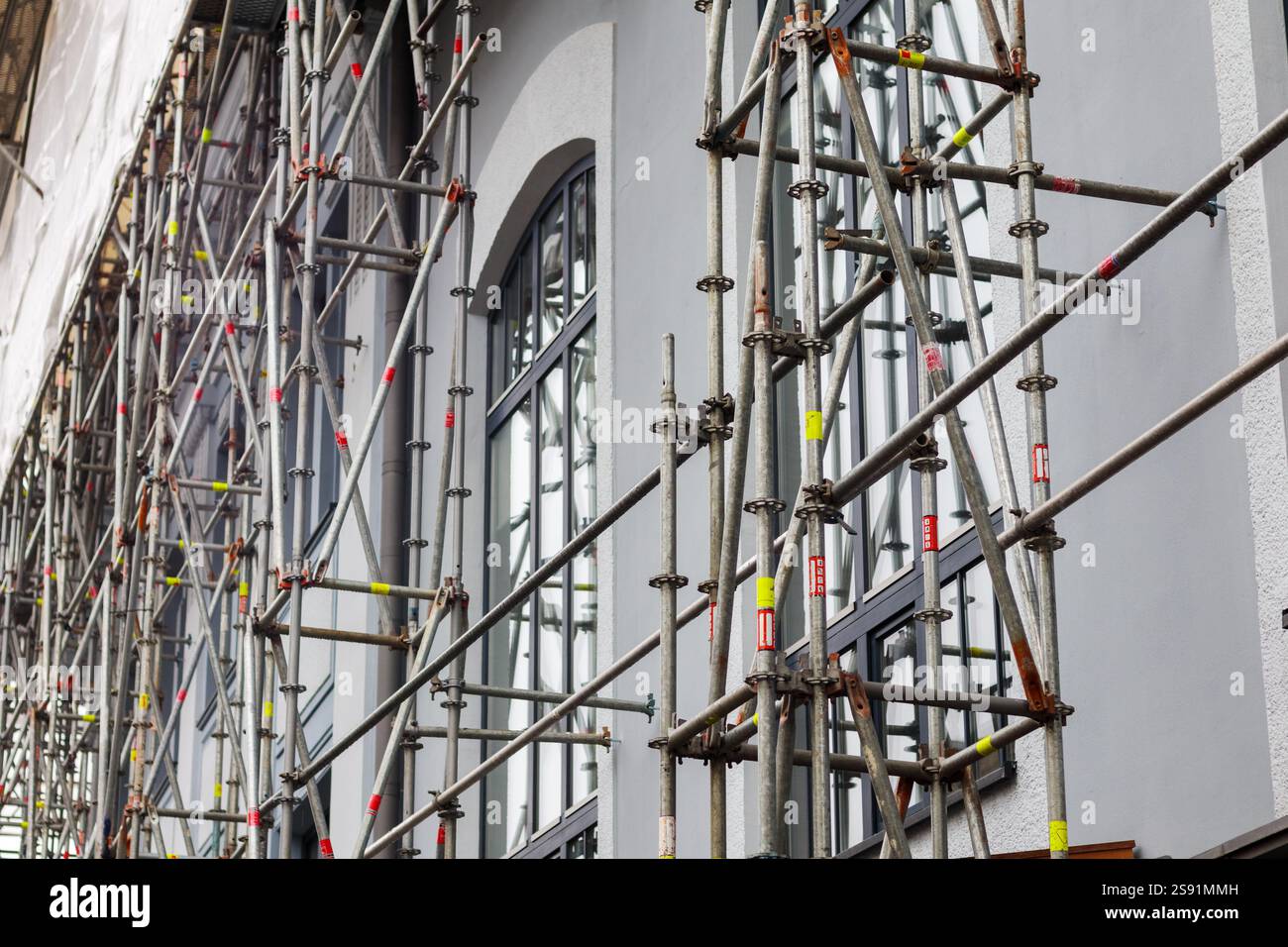 The facade of the building, which is completely covered by construction ...