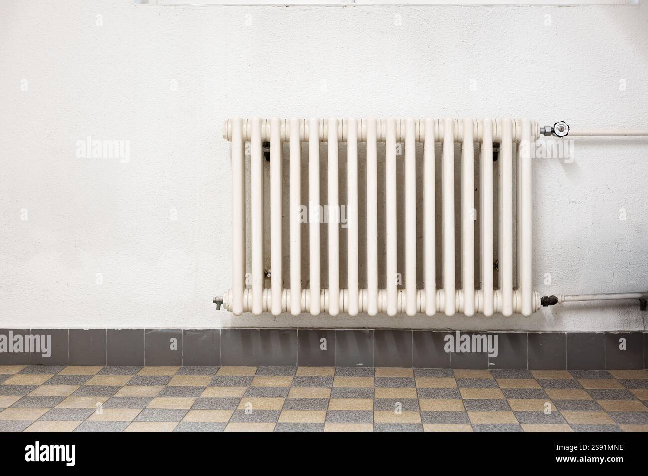 Cast iron radiator heater elements, wall mounted inside apartment room ...