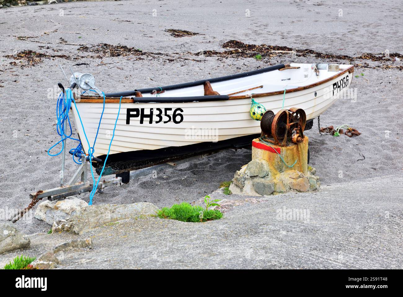 Fishing boat in the small harbour at Finnygook beach, Portwrinkle ...