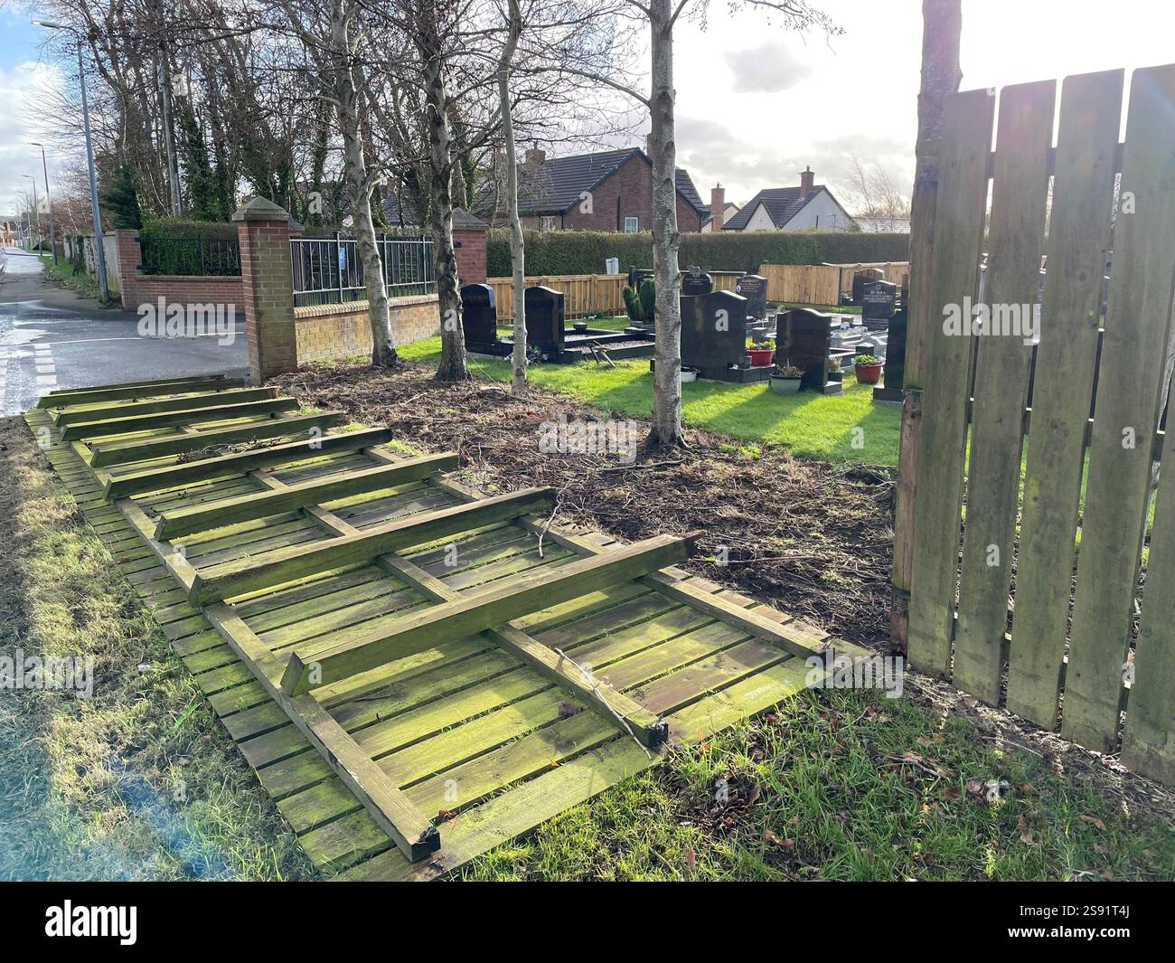 A fallen fence at a cemetery on Blaris Road, Co Antrim. Residents ...