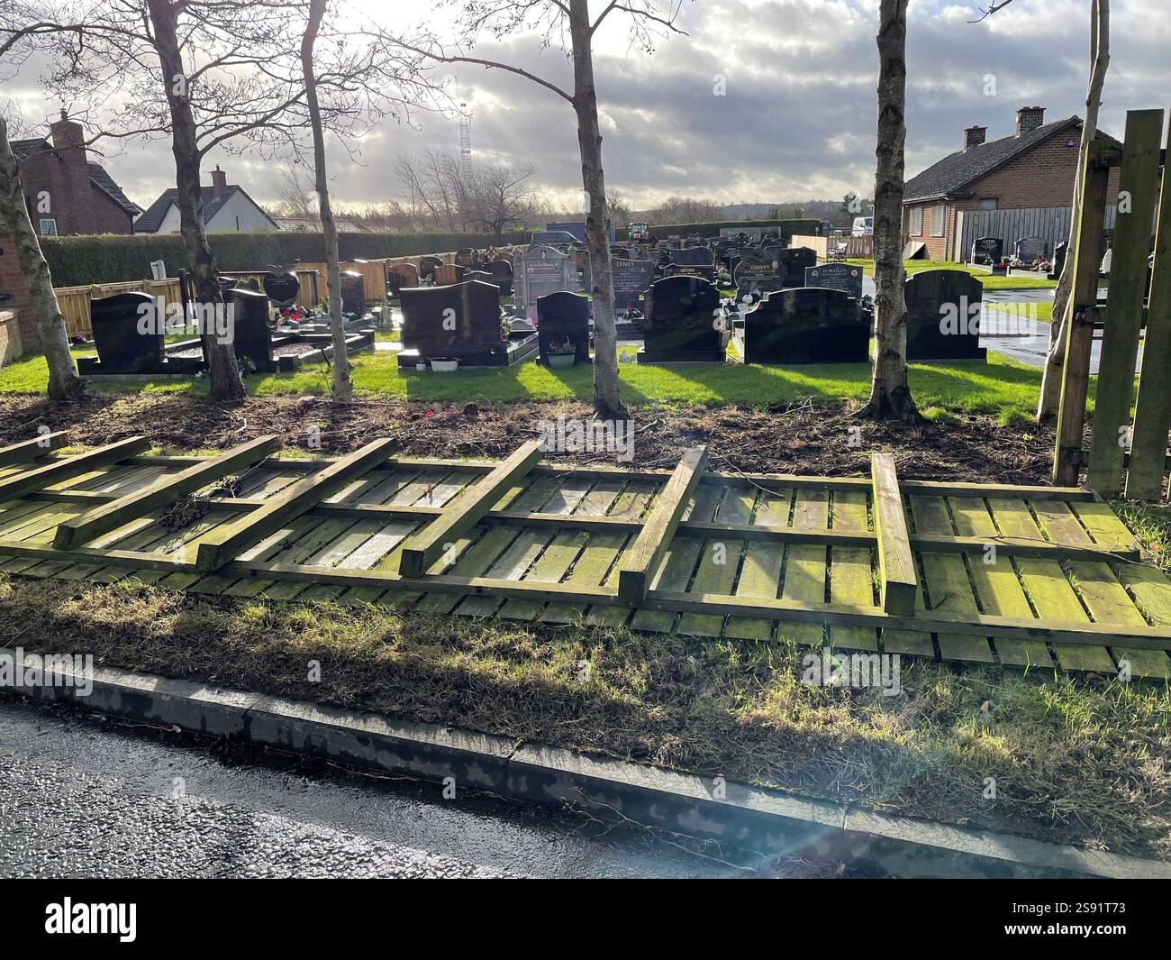 A fallen fence at a cemetery on Blaris Road, Co Antrim. Residents ...