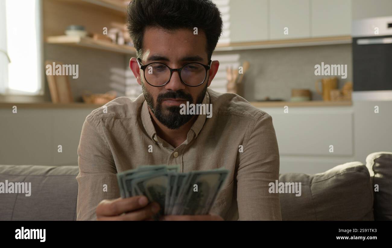 Indian Arabian man cash owner worried businessman at home kitchen ...