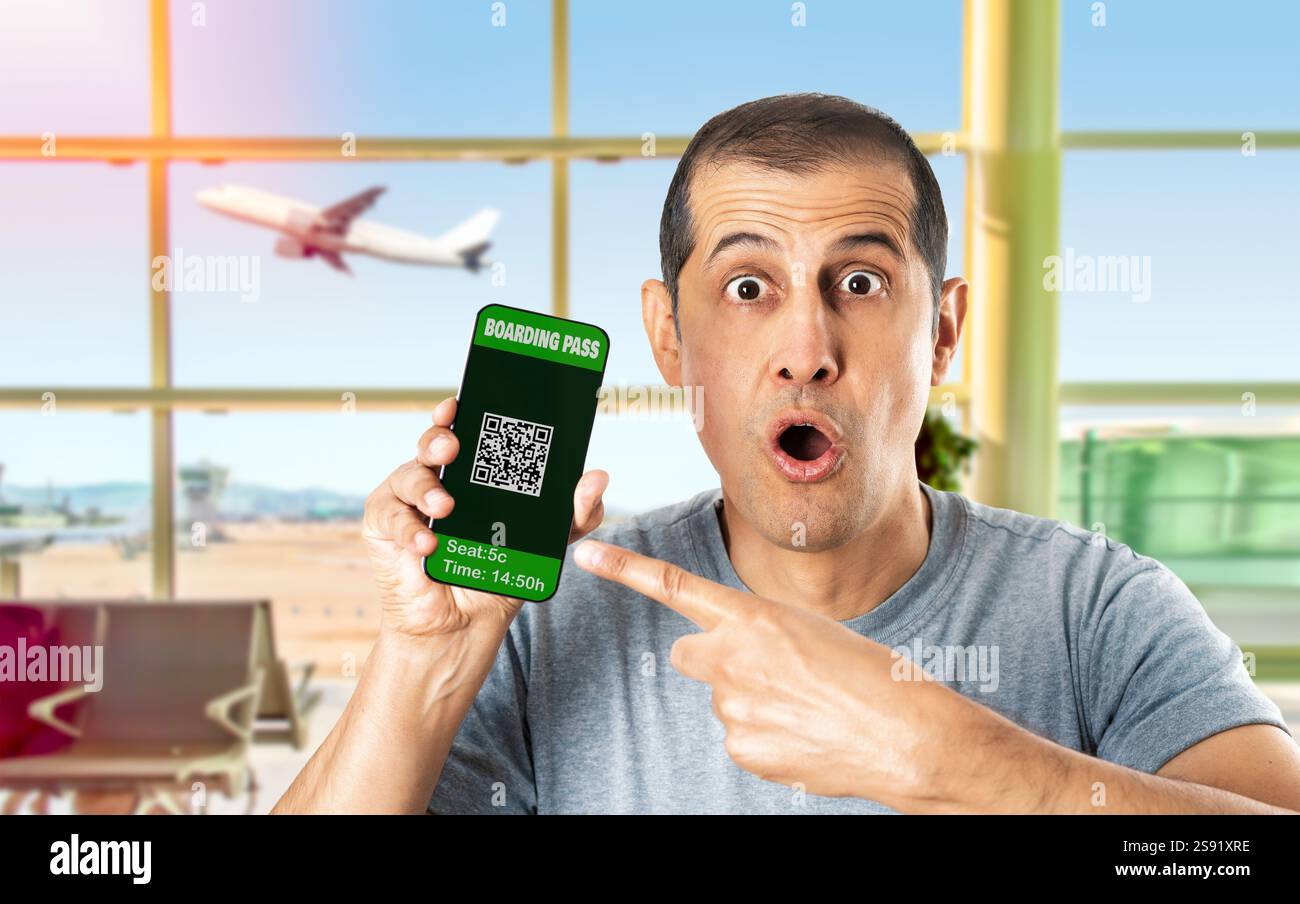Man using phone at airport with surprise face pointing and holding ...