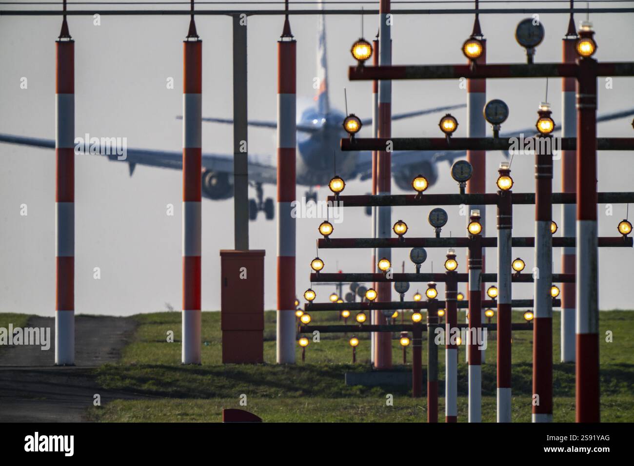Aircraft approaching the main runway south, 05R/23L, runway lighting ...