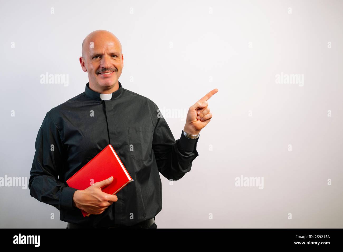 Priest man pointing hand hi-res stock photography and images - Alamy