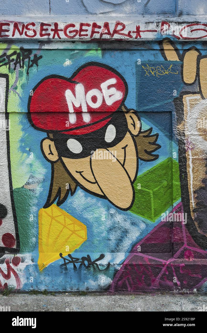 Graffiti, face with black mask on the abattoir wall, Munich, Upper ...