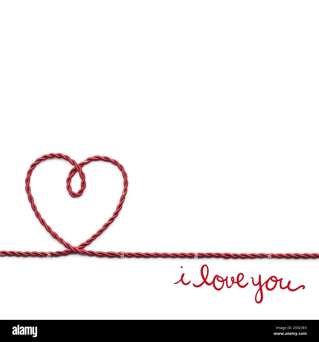 Creative valentines concept photo of a heart mad of rope on white ...