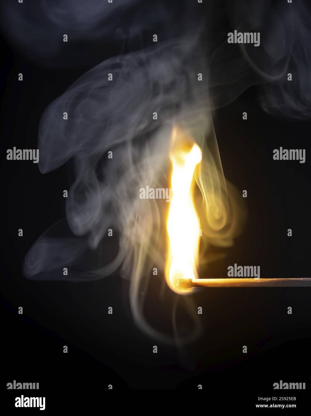 An image of a match flame dark background Stock Photo - Alamy