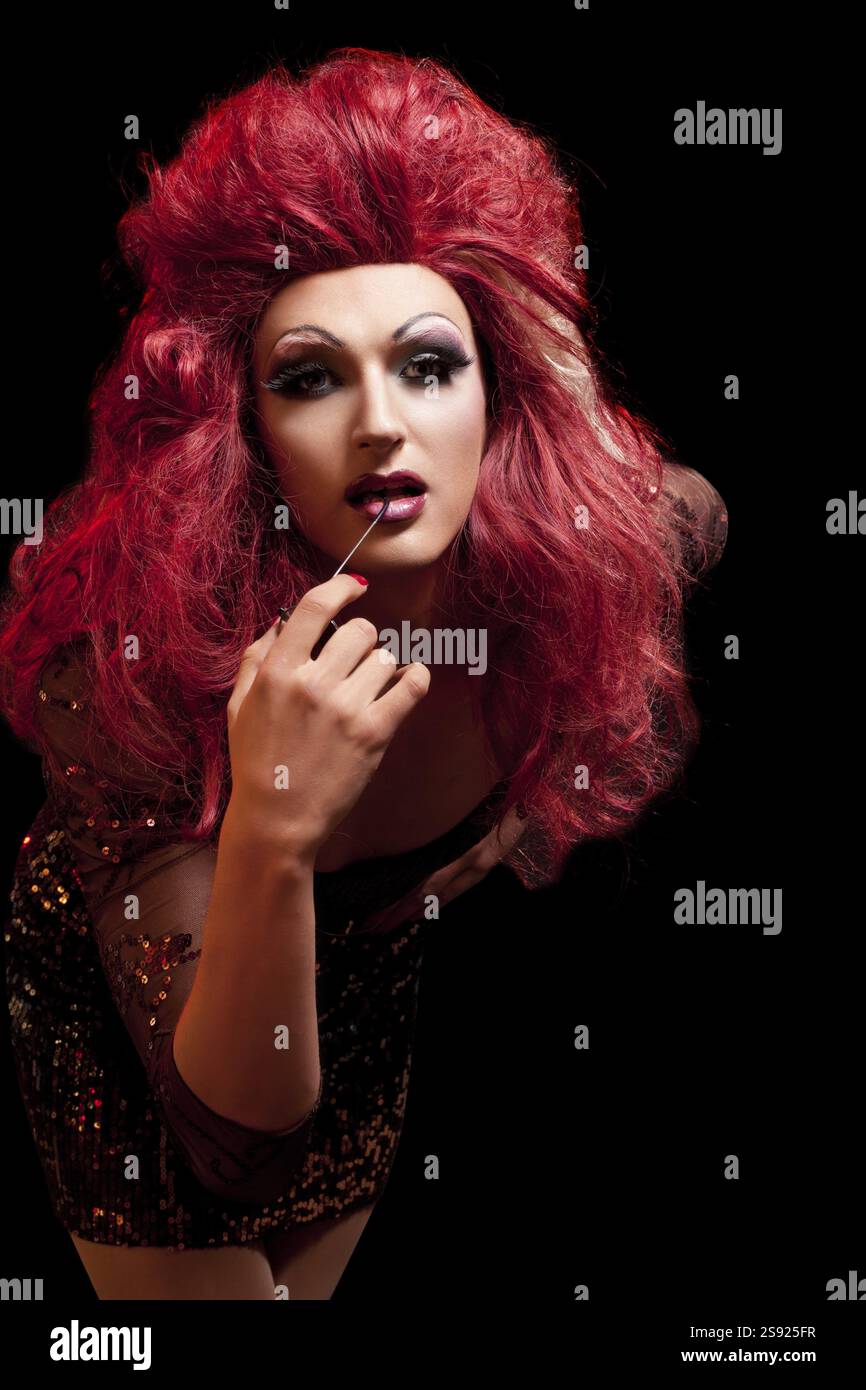 Drag Queen. Man dressed as a woman. On black Stock Photo - Alamy