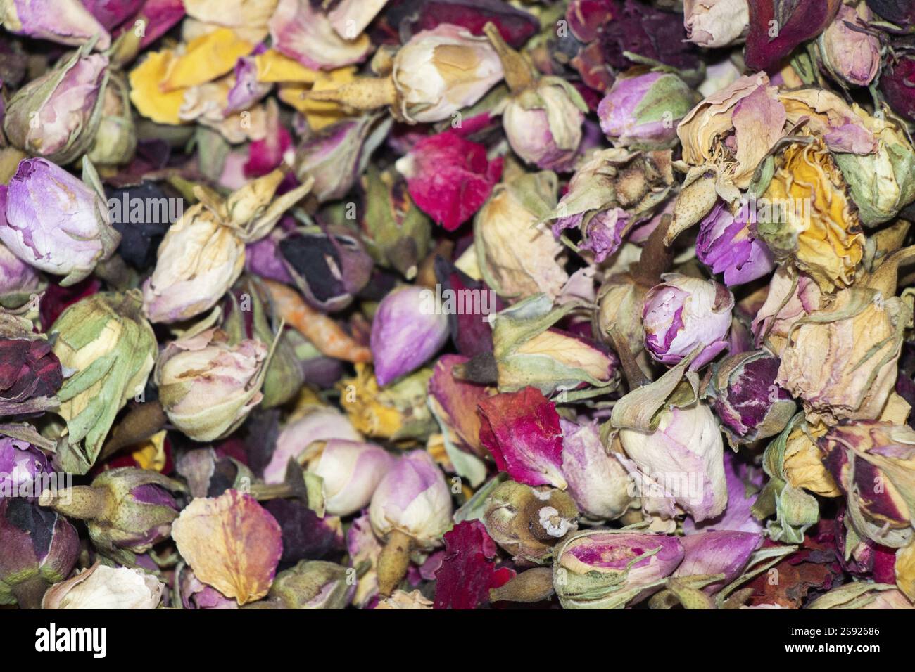 Dried rose buds background. Rose buds for herbal tea Stock Photo - Alamy